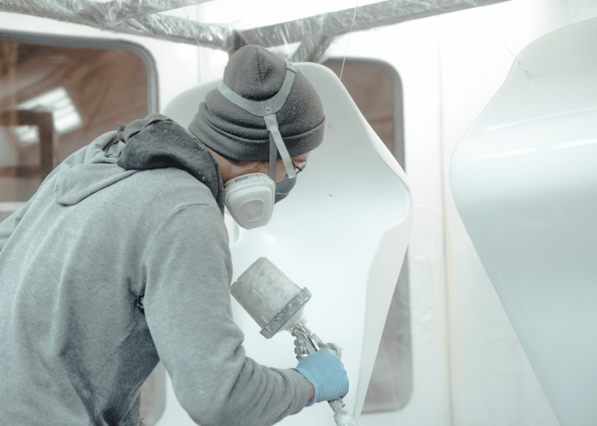 A DELICATE AND PRECISE TASK: PAINTING AN IGUANA. | Iguana Yachts